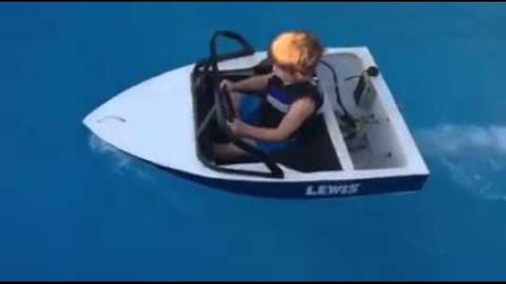 Little Boy Drives Speedboat in Pool