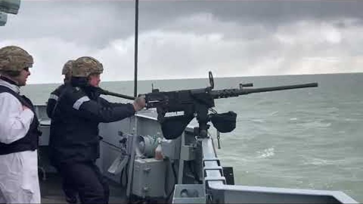 HMS Lancaster fires.50 (12.7mm) calibre heavy machine gun